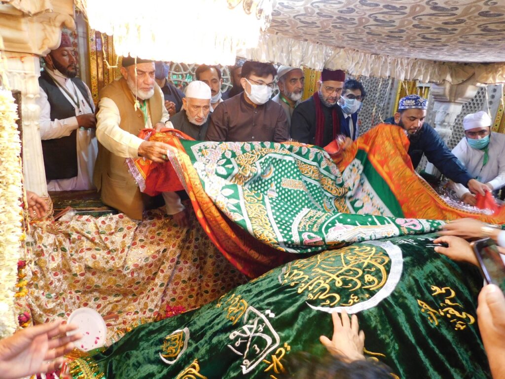 A delegation of Pakistani Zaireen lays traditional Chaddar at Dargah ...